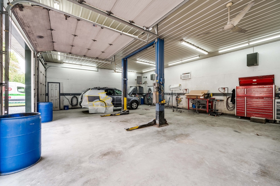 Pennsylvania home puts the drive in 'driveway.' It comes with auto body shop, $1.3 million price ...