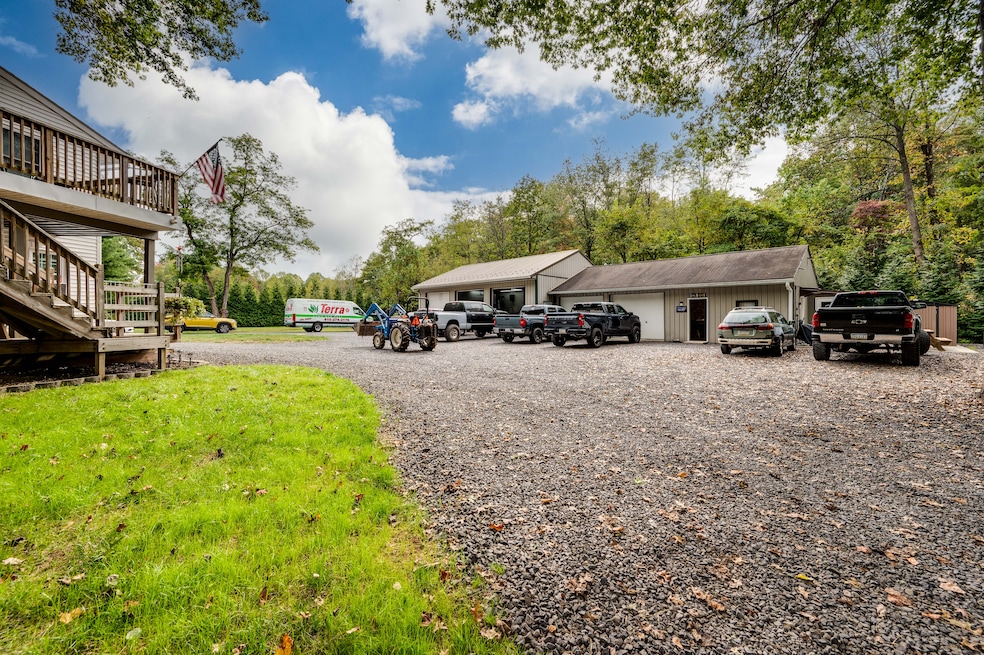 Pennsylvania home puts the drive in 'driveway.' It comes with auto body shop, $1.3 million price ...